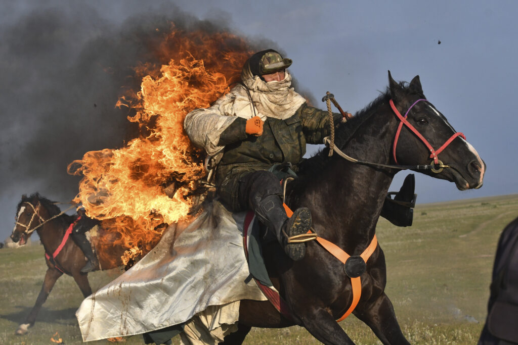 Participants of The Gallops' 2025 show their skills during the competition near the alpine Song-Kol Lake, 280 km, (175 miles) southeast of Bishkek, Kyrgyzstan, Monday, July 21, 2025.