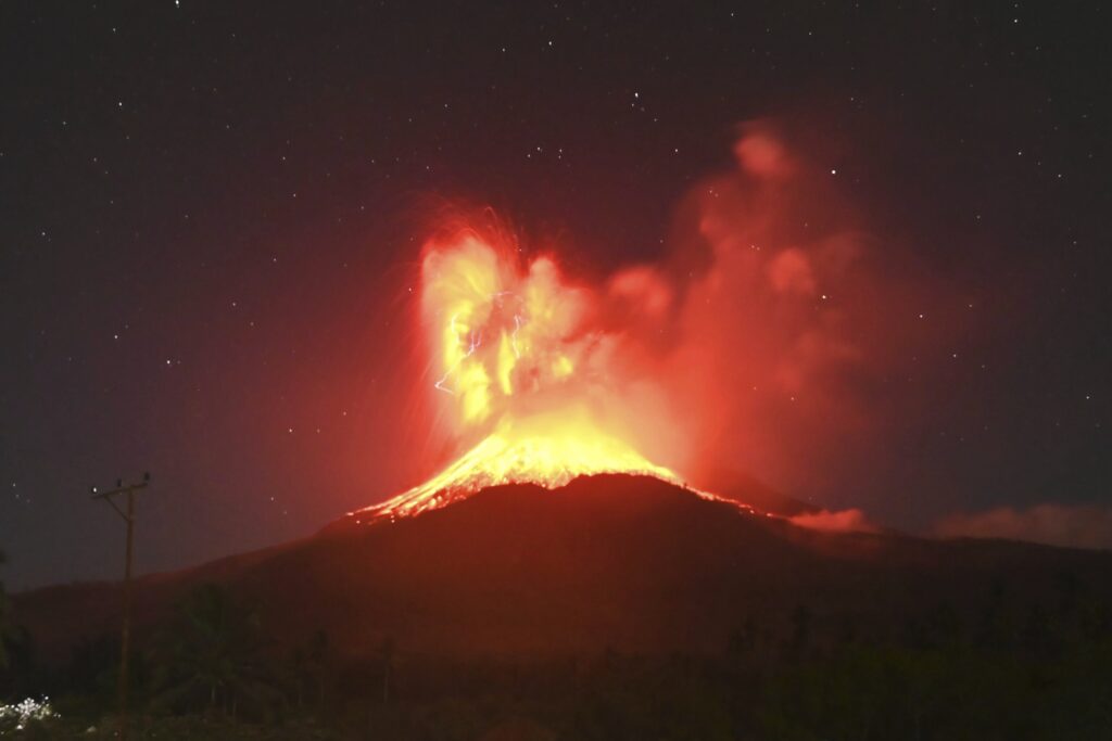 In this photo released by Geological Agency Photo: Badan Geologi) of the Indonesia's Ministry of Energy and Mineral Resources, lava glows on the slope of Mount Lewotobi Laki-Laki during an eruption in East Flores, Indonesia, Friday, August. 1, 2025.